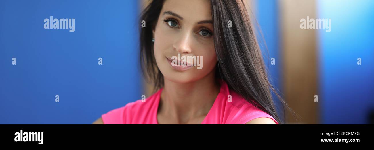 Cute fit woman looking at camera with happiness Stock Photo - Alamy