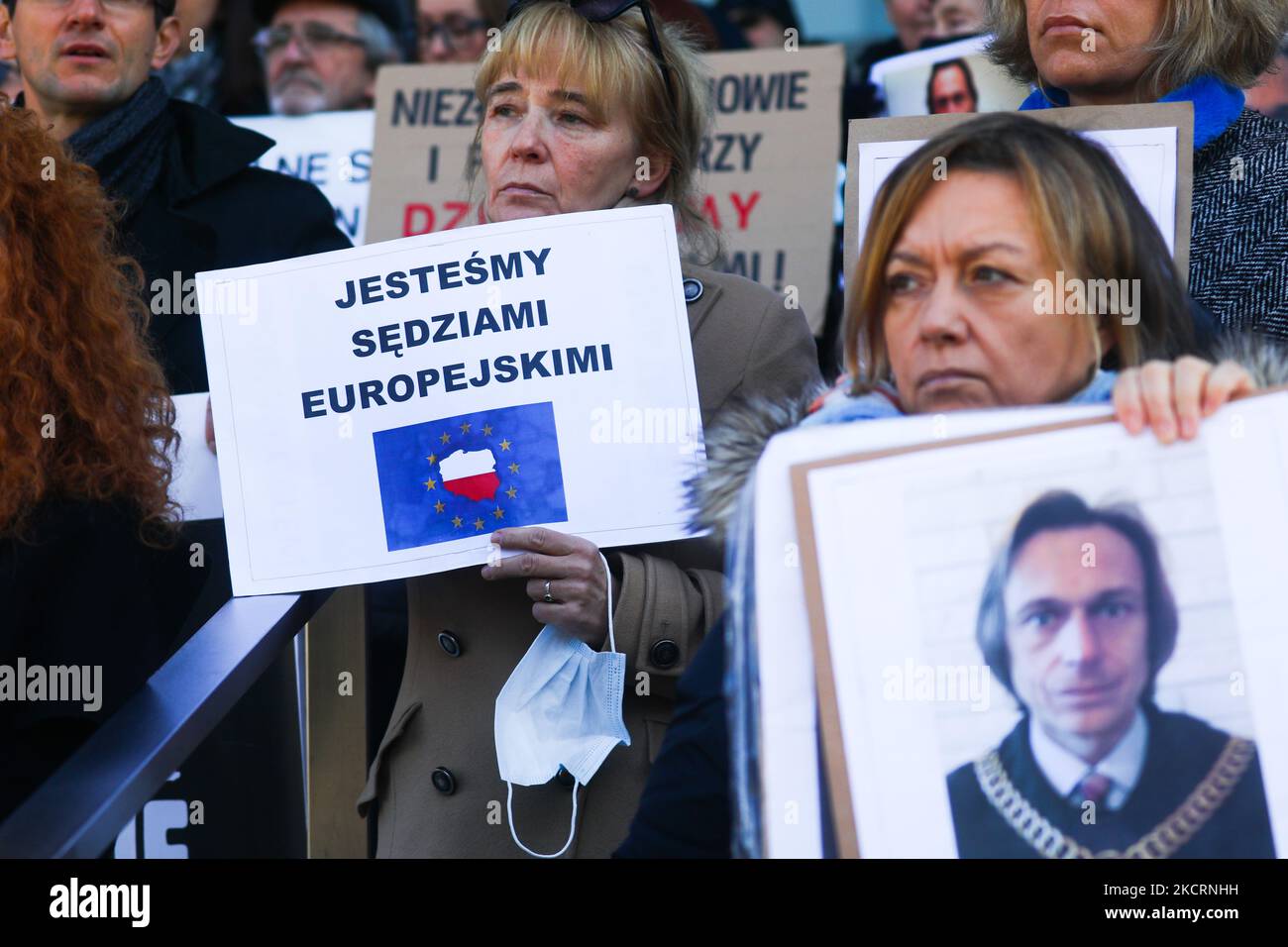 A woman holds a banner 'We are European judges' during a rally in front ...