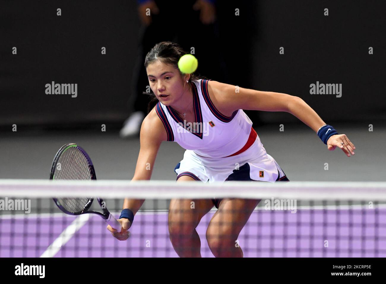 Emma Raducanu in action - receiving the ball during her match against ...
