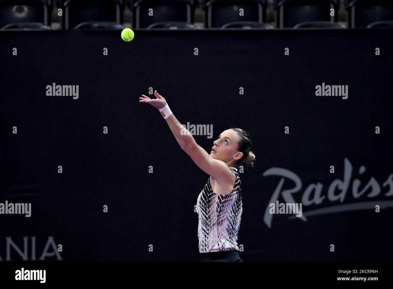 Ana Bogdan in action - serving the ball during her match against Emma ...