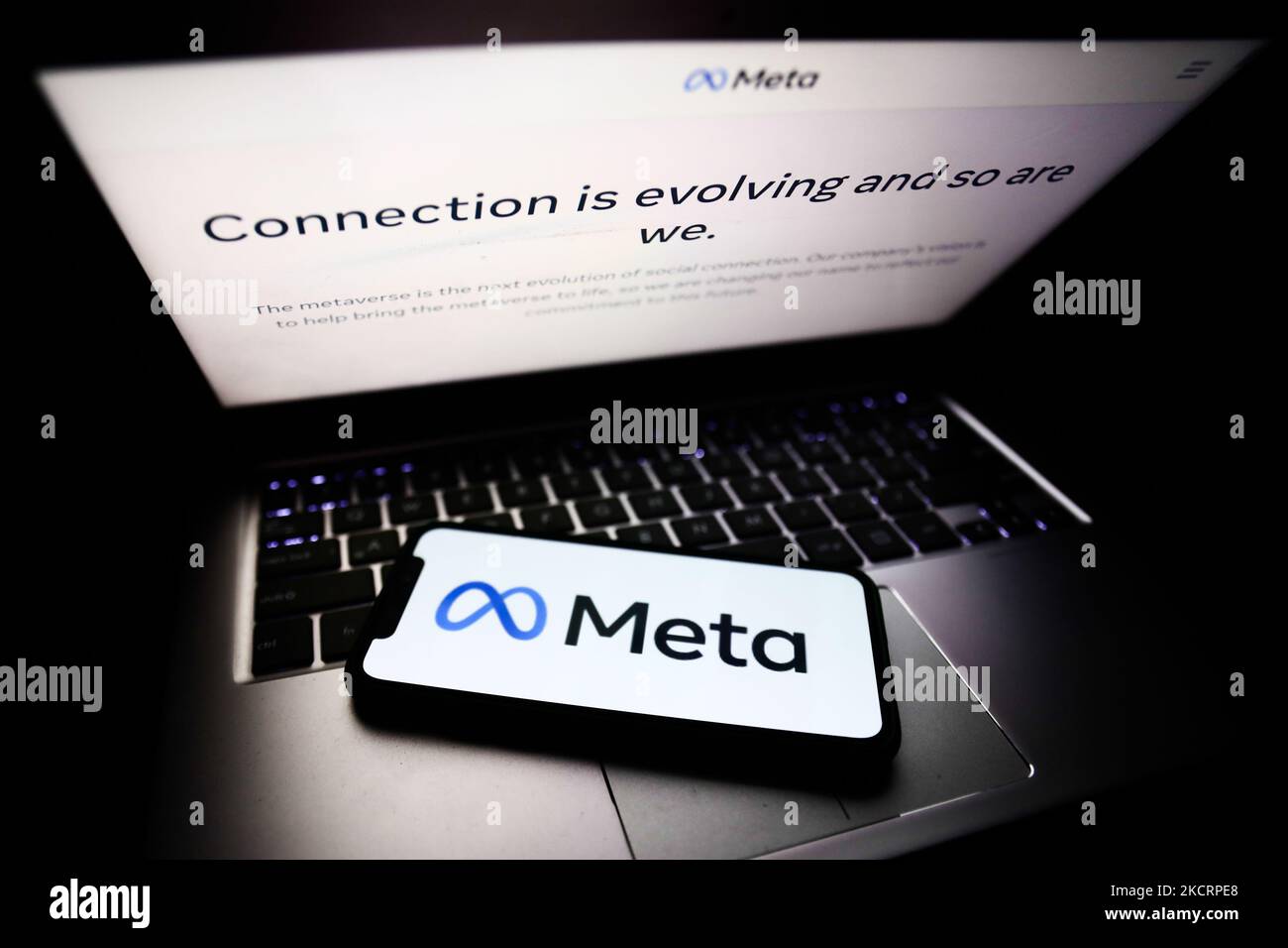 Meta website displayed on a laptop screen and Meta logo displayed on a ...