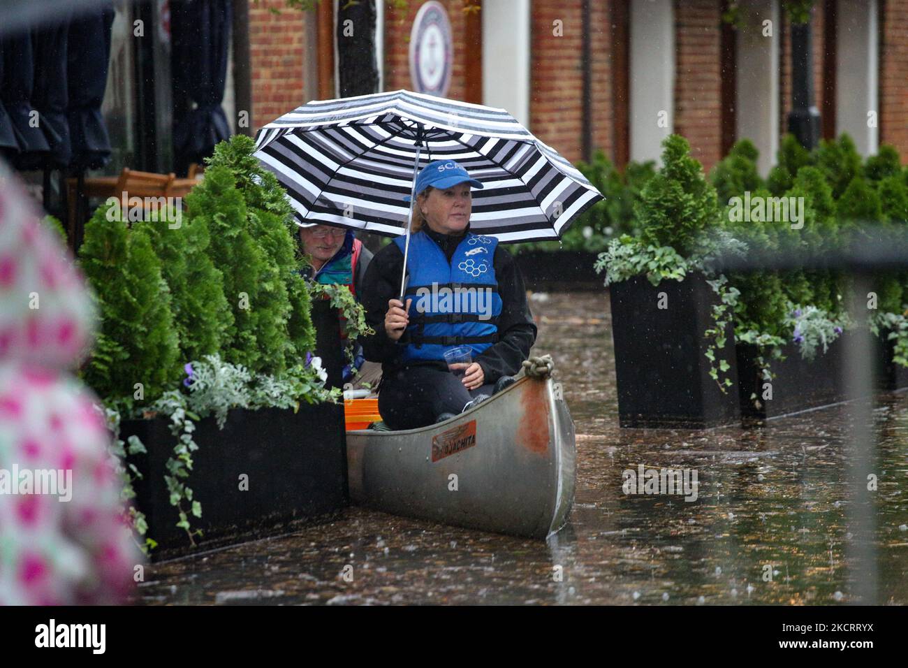 Woman canoe rain hi-res stock photography and images - Alamy