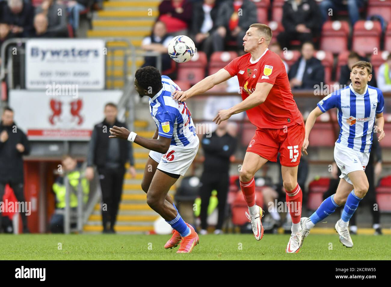 Mike Fondop of Hartlepool United contests a header with Alex Mitchell ...