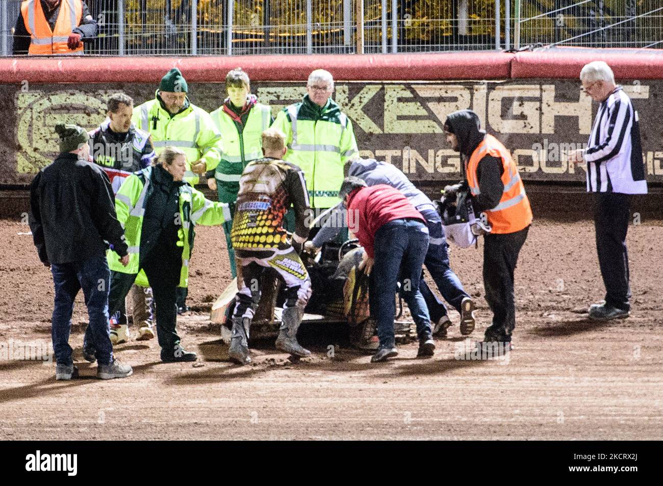 Medics and track staff at the crashed sidecar during the Manchester ...