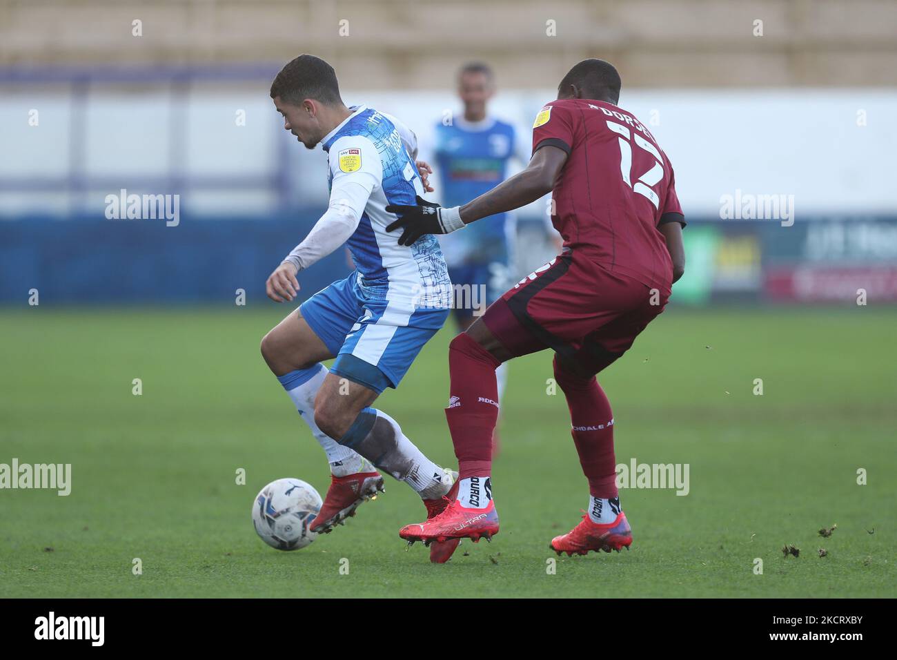 Josh Gordon of Barrow in action with Rochdale's Jeriel Dorsett during ...