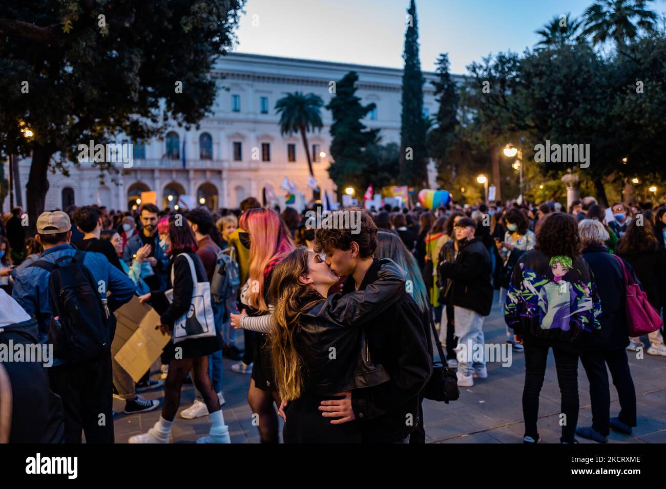 Couple kisses during protest against hi-res stock photography and ...