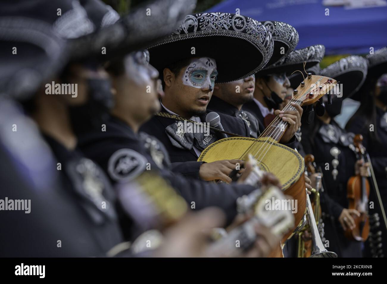 A mariachi group sings at the Day of the Dead (Dios de los Muertos ...