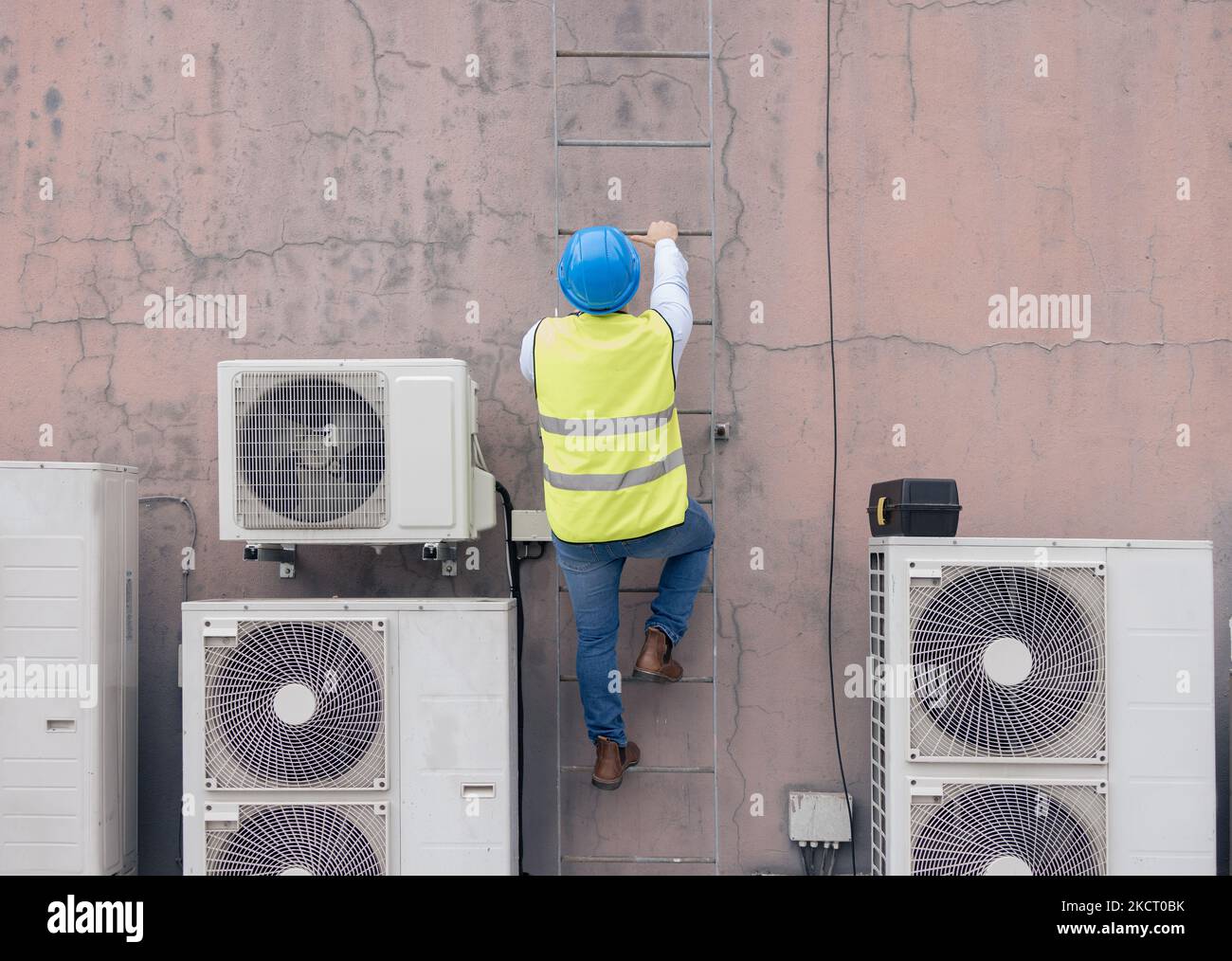 Construction, ladder and building with a man engineer climbing up a ...