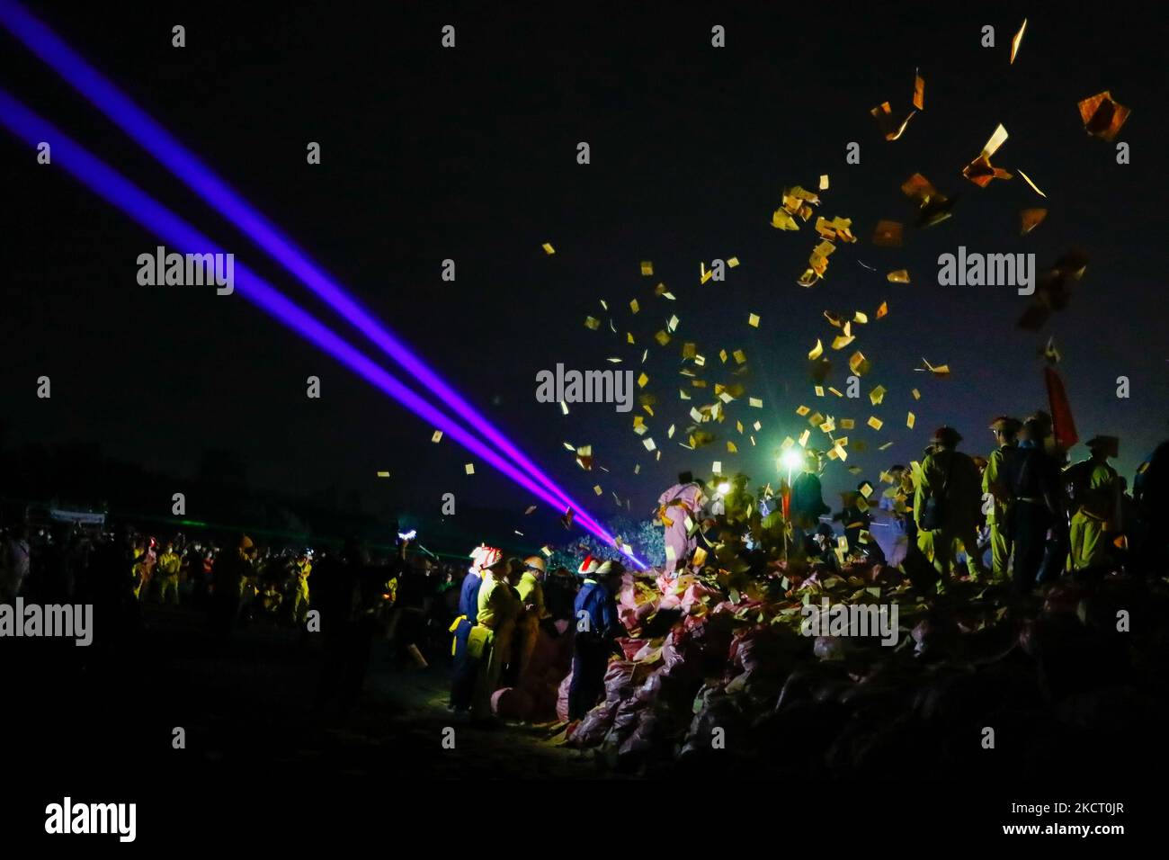 Believers scatter underground banknotes before burning the King Boat to ...