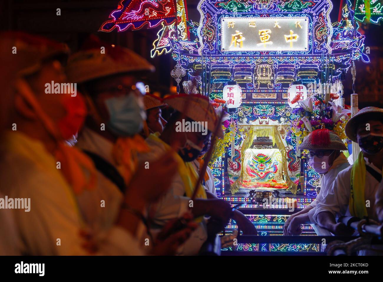Believers at Donglong Temple take part in a ritual to call upon gods to ...