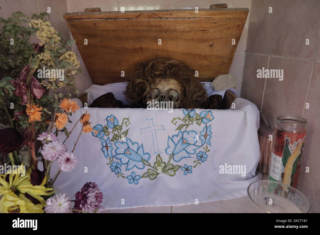 A skull inside a box in the cemetery of Pomuch, an indigenous Mayan ...