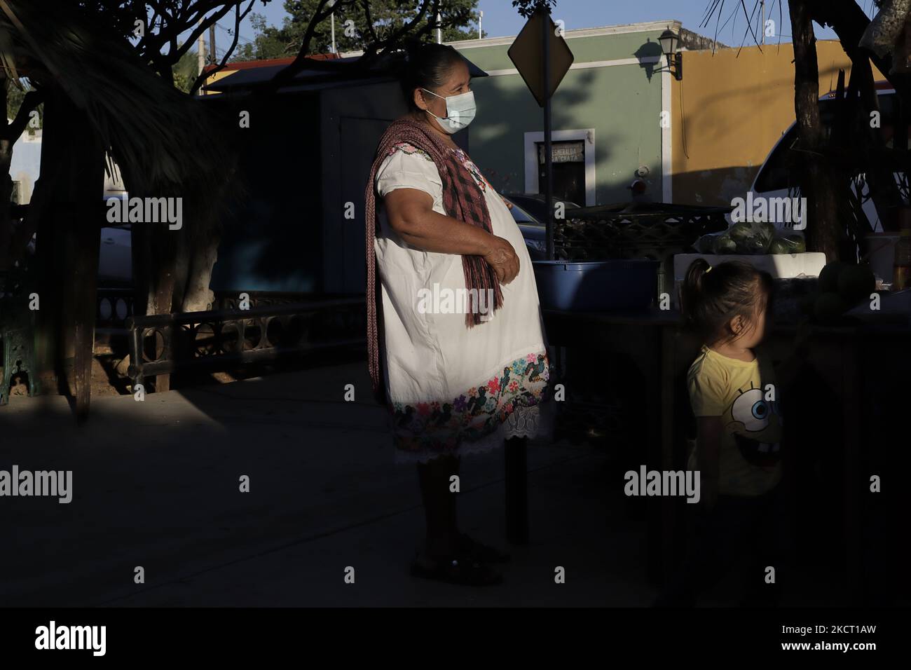 A woman wears a typical costume from the indigenous Mayan community of ...