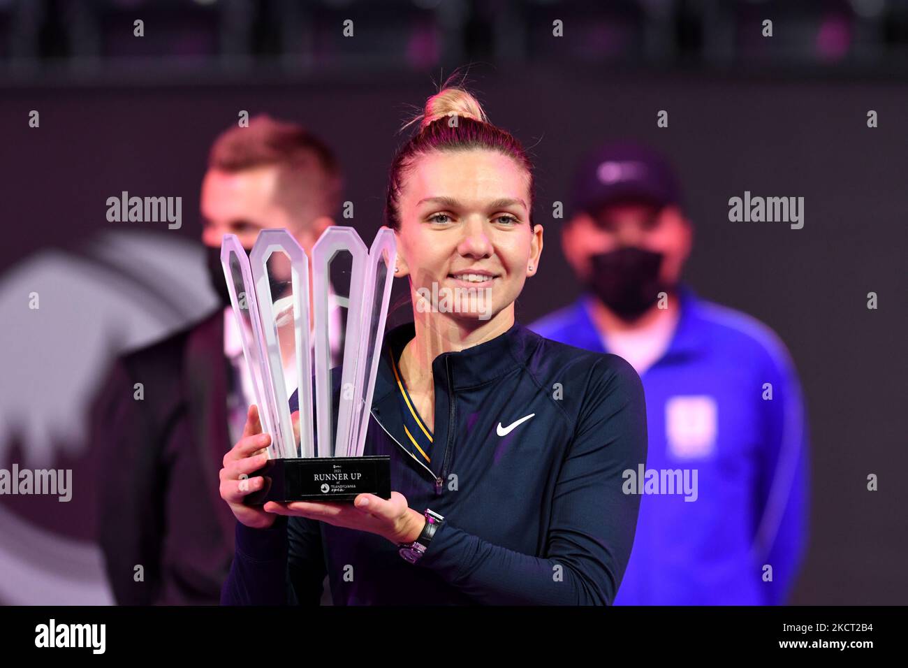 Portrait of Simona Halep receiving her trophy after loosing her match ...