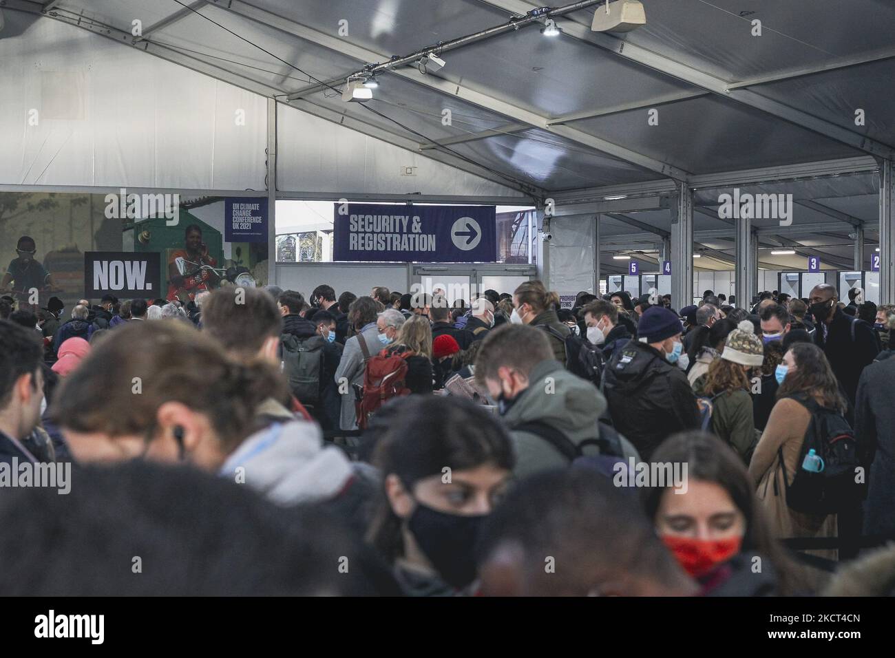 People wait outside the venue on day three of the COP 26 United Nations ...