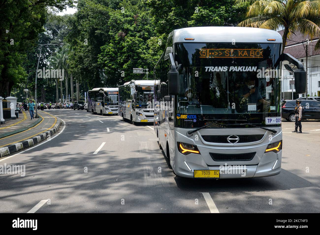 A Kita Trans Pakuan bus drives on a main road in Bogor, Indonesia on ...