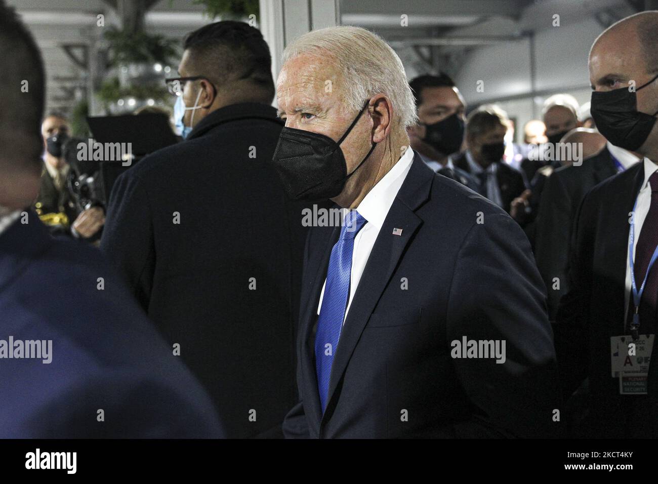 President Joe Biden walks though a corridor on day three of the COP 26 ...