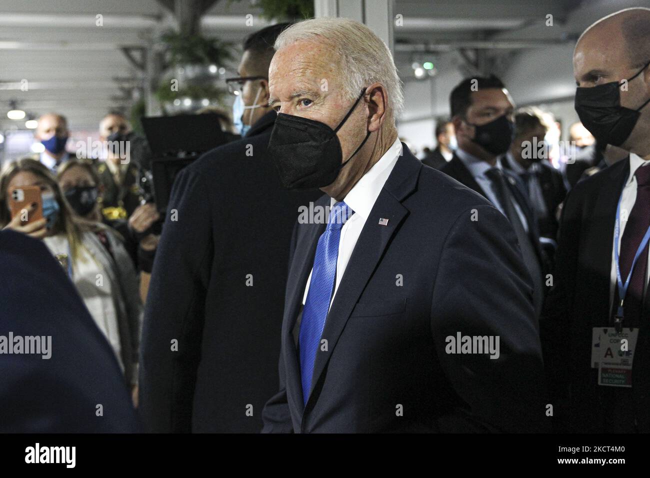 President Joe Biden walks though a corridor on day three of the COP 26 ...