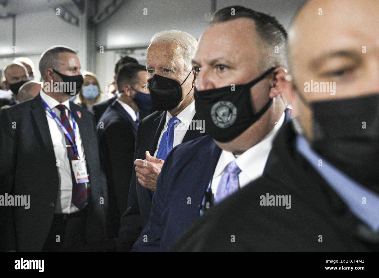President Joe Biden walks though a corridor on day three of the COP 26 ...