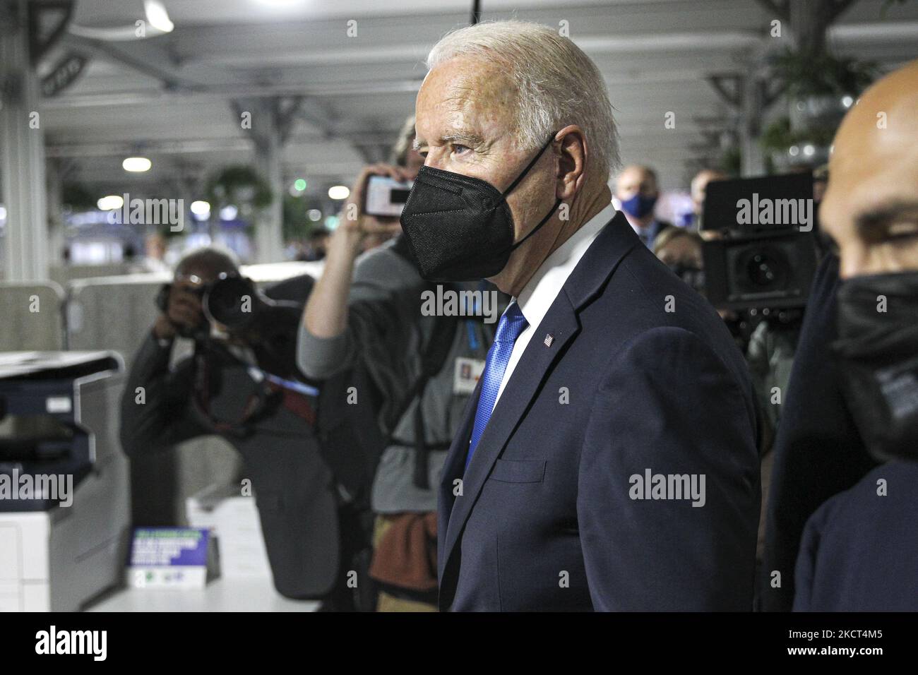 President Joe Biden walks though a corridor on day three of the COP 26 ...