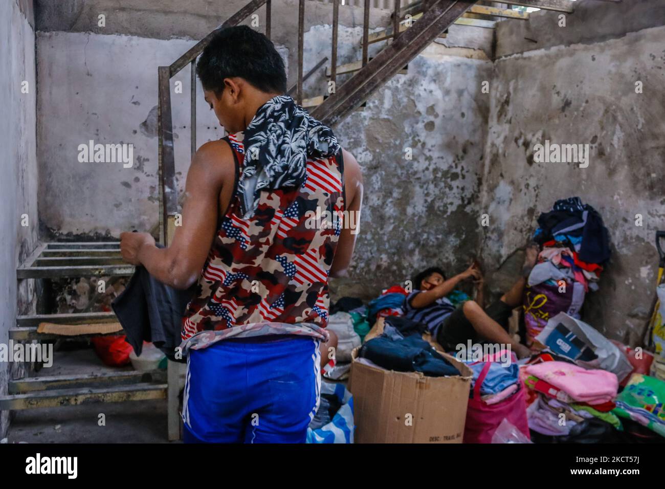 Victims of 3rd alarm fire scavenge and check their houses today ...