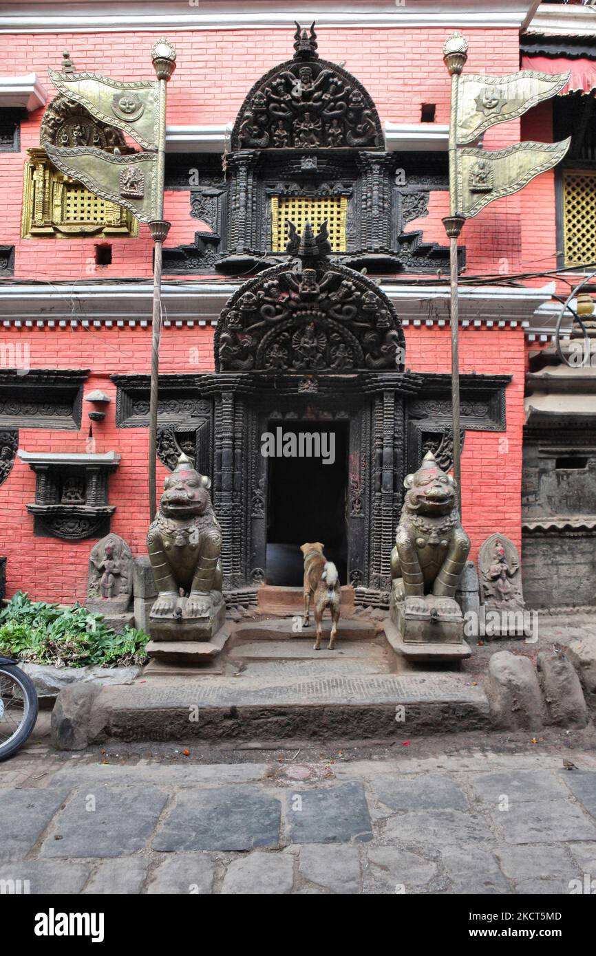 Temple facade with decorative tympanums and golden flags in the ancient ...