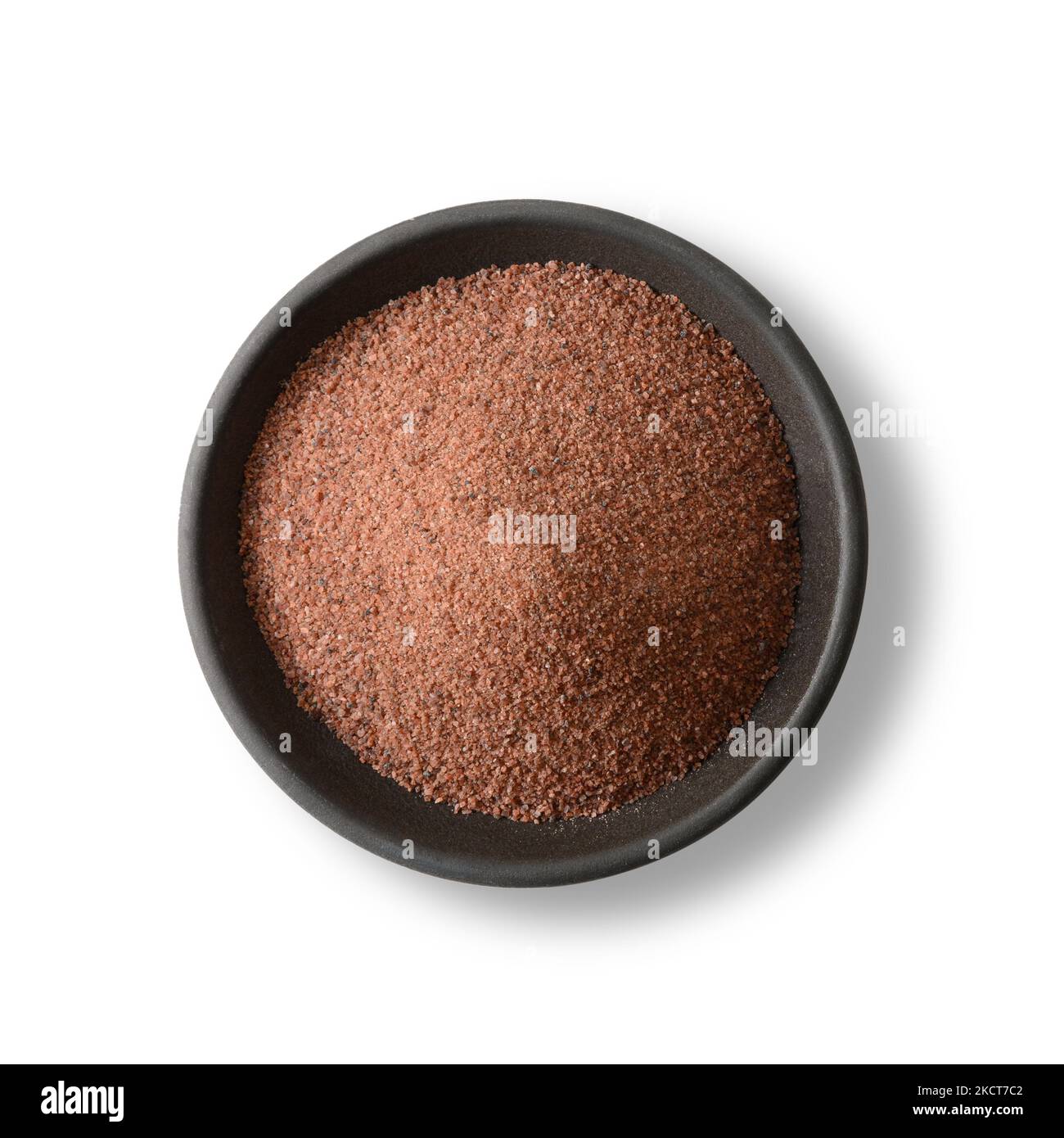 Indian Black salt, Kala namak in black bowl isolated on white ...
