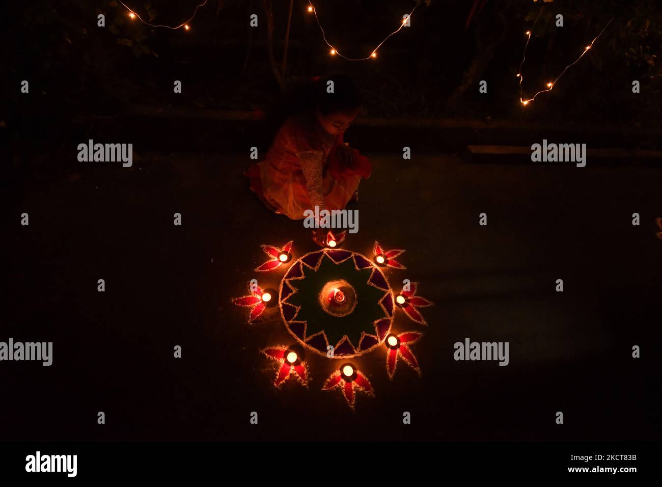 Women make a rangoli on the occasion of Diwali in Nagaon District of ...
