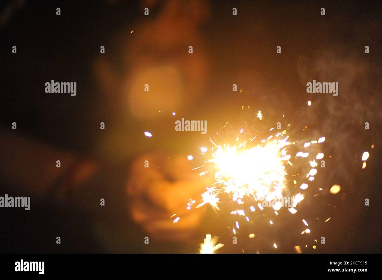 A Little Boyburns sparklers (fire crackers) in during Laxmi Puja of ...