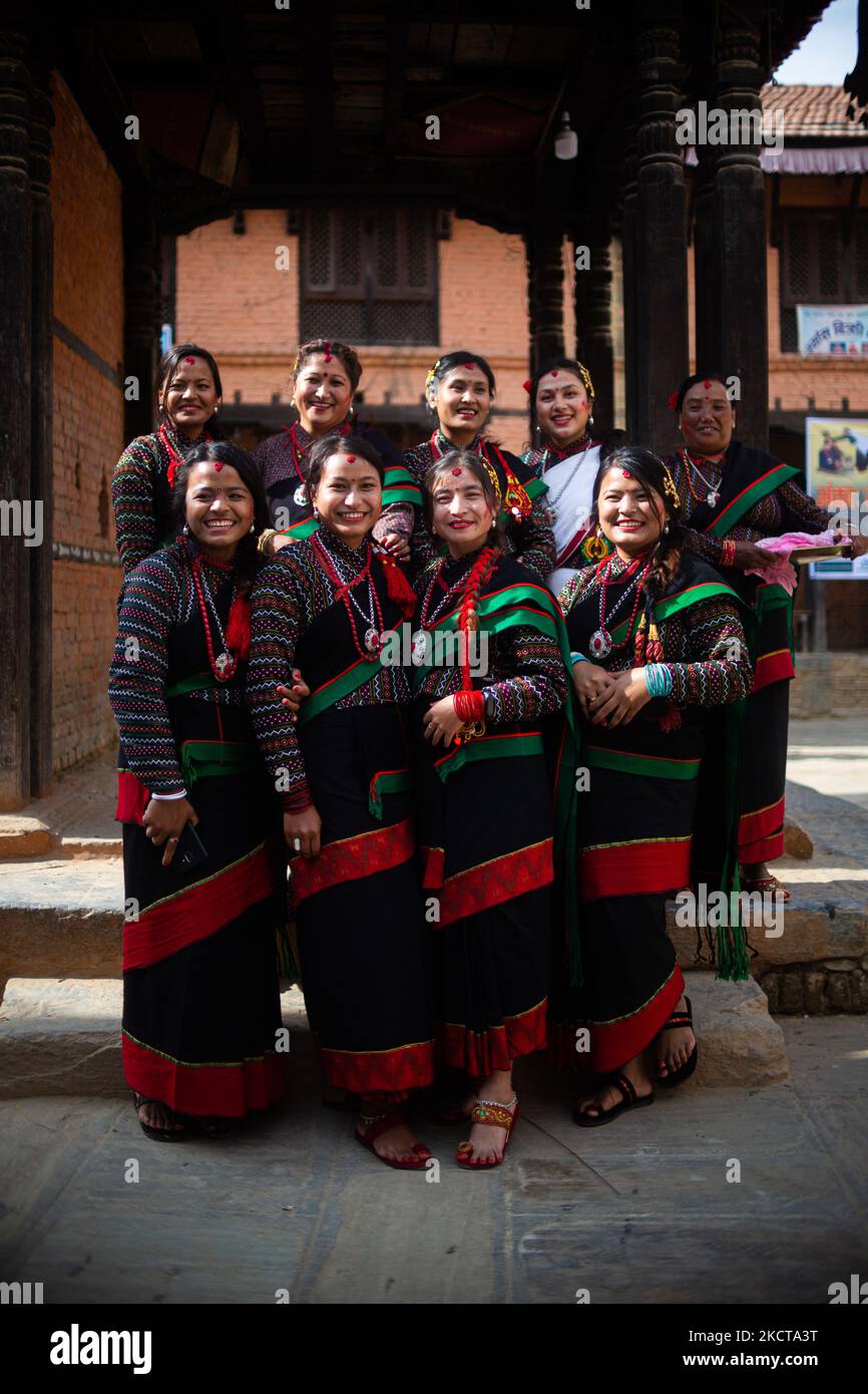 Nepalese girls dressed in traditional Newari attire pose for a photo as ...