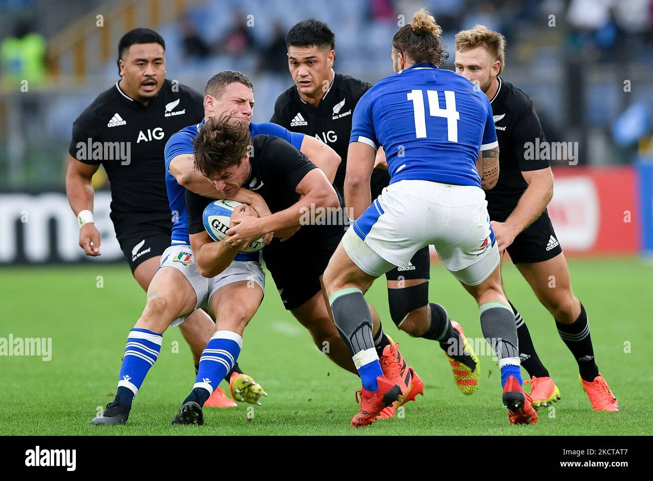 George Bridge of New Zealand All Blacks challenged by Paolo Gabrisi of ...
