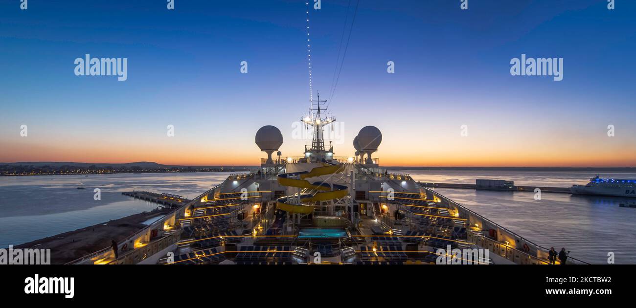 Promenade deck of a cruise ship in navigation with sunset Stock Photo ...