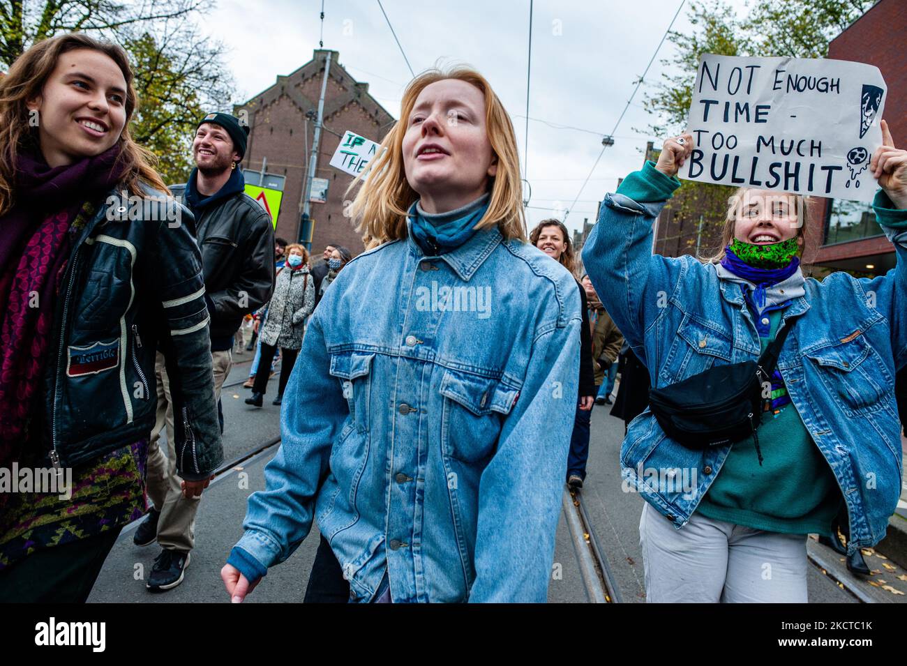 A woman is shouting slogans against climate change, during a massive ...