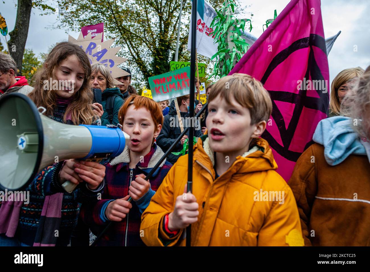 Two little children are shouting slogans against climate change, during ...