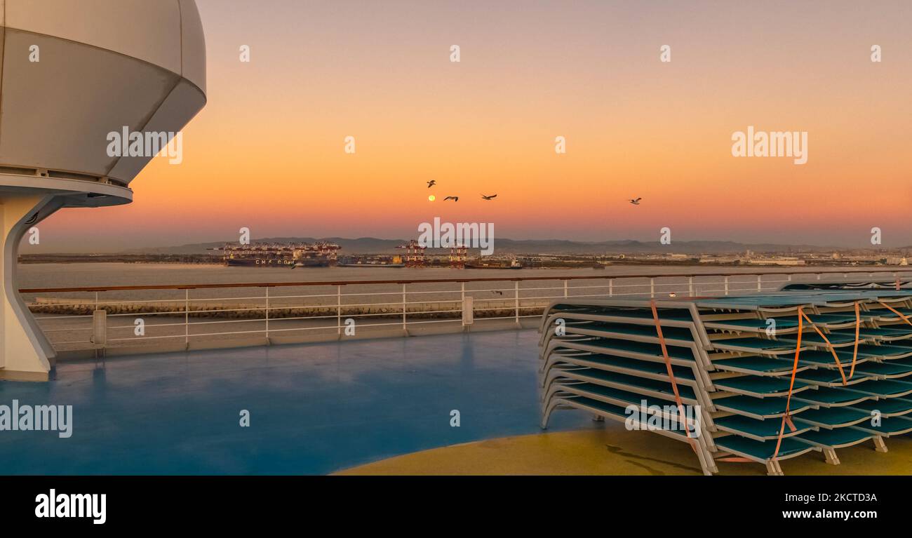 Promenade deck of a cruise ship in navigation with sunset Stock Photo ...