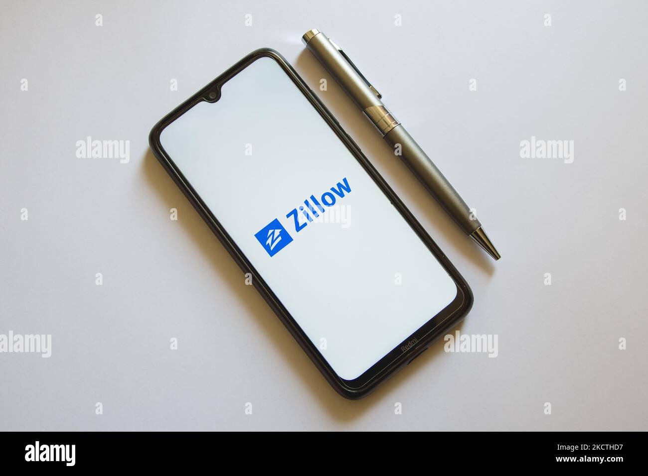 In this photo illustration a Zillow logo is display on a smartphone ...