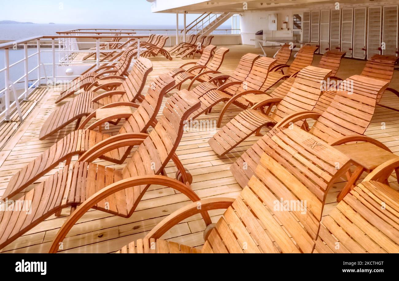 Promenade deck of a cruise ship in navigation with sunset Stock Photo ...