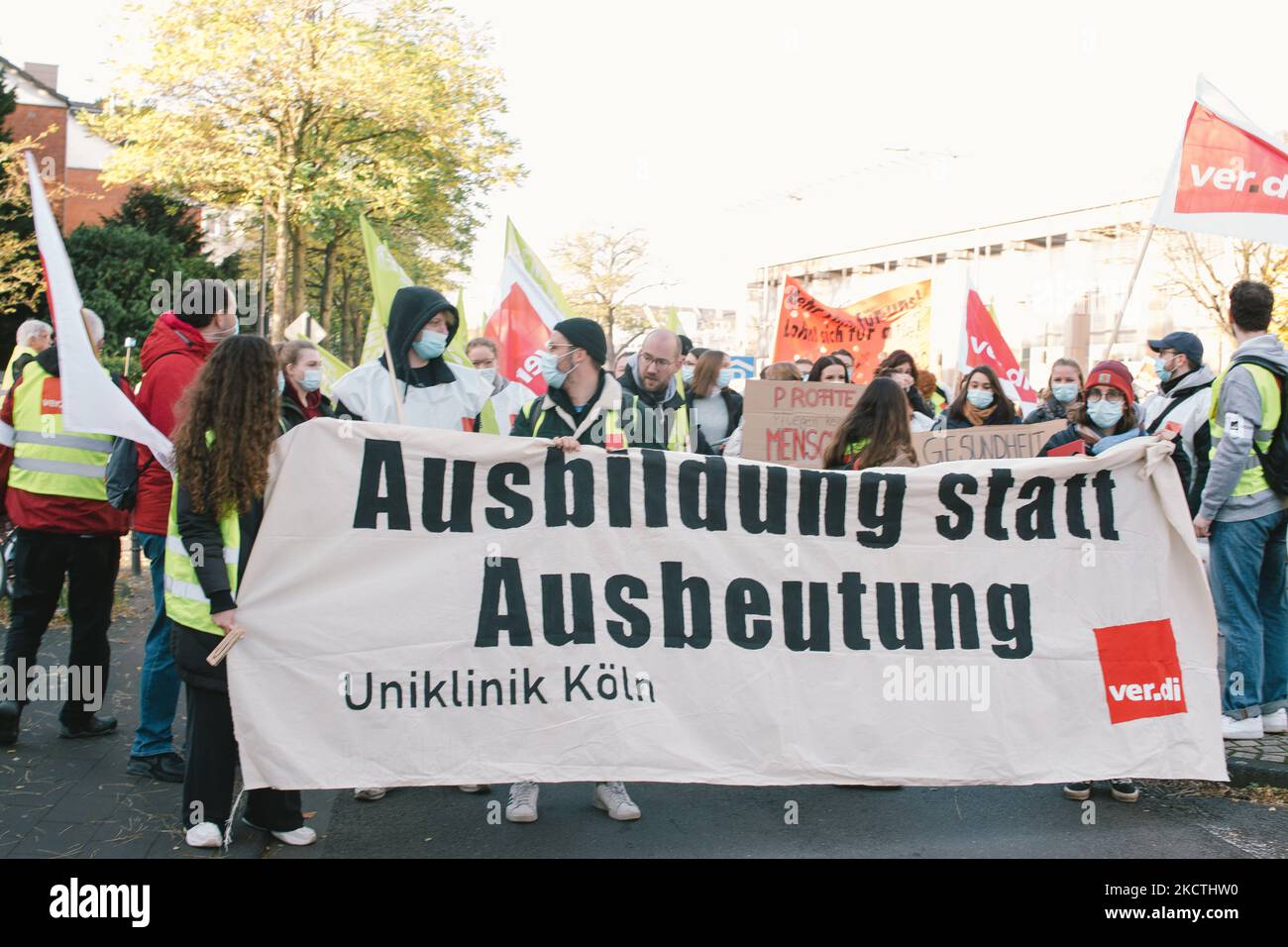 protesters hold a banner "training instead exploitation" is seen during ...