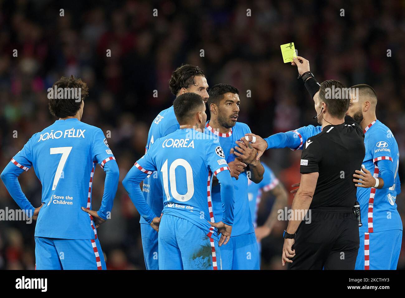 Luis Suarez of Atletico Madrid is shown a yellow card during the UEFA ...