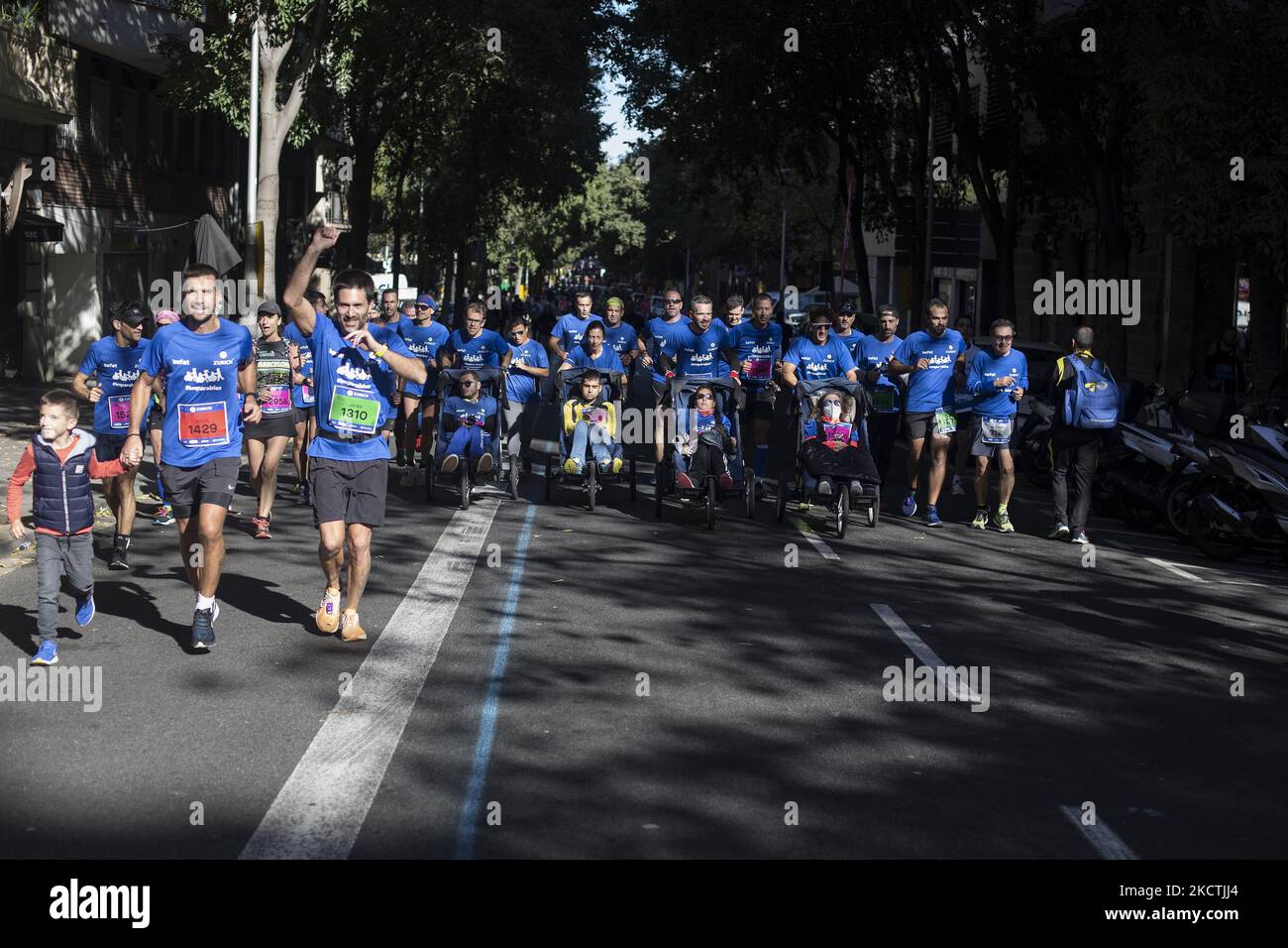 People take part in the Barcelona Marathon, in Barcelona, Spain, on ...
