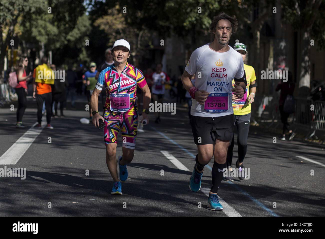 People take part in the Barcelona Marathon, in Barcelona, Spain, on ...