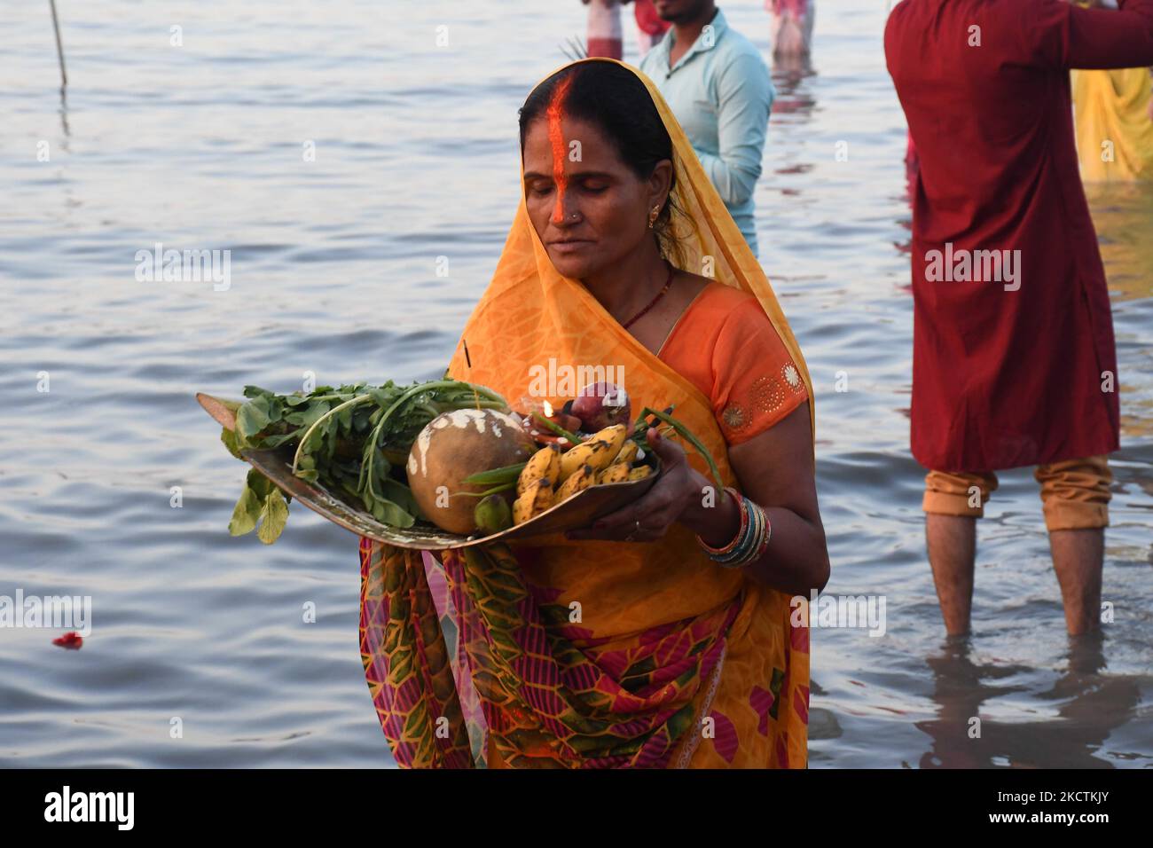 Hindu devotees offer prayers during 'Chhat Puja' festival on the banks ...