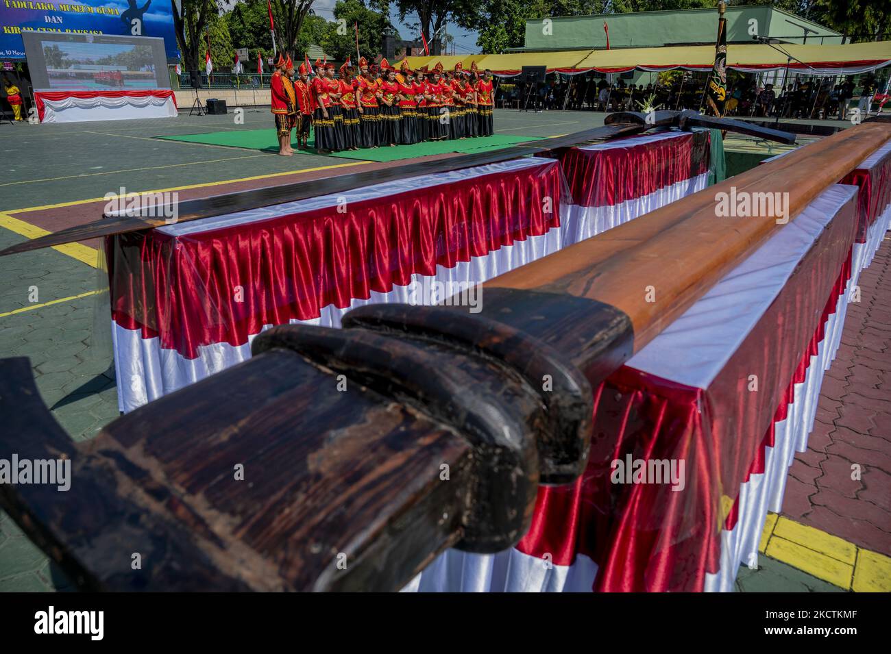 Teenagers dance and sing folk songs before the 7.7-meter and 1.2-ton ...