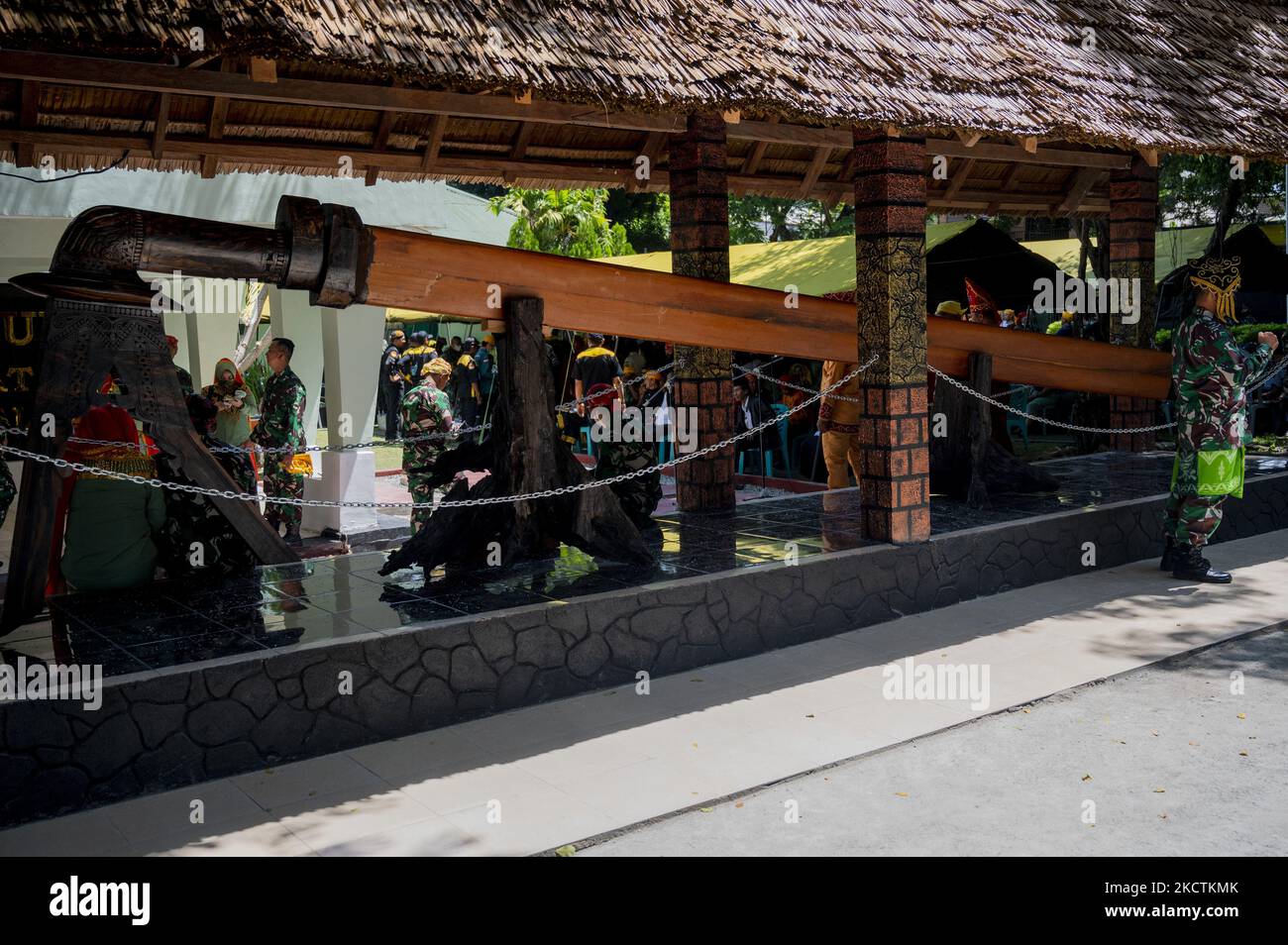 Residents walk near a giant 7.7 meter and 1.2 ton Guma traditional ...