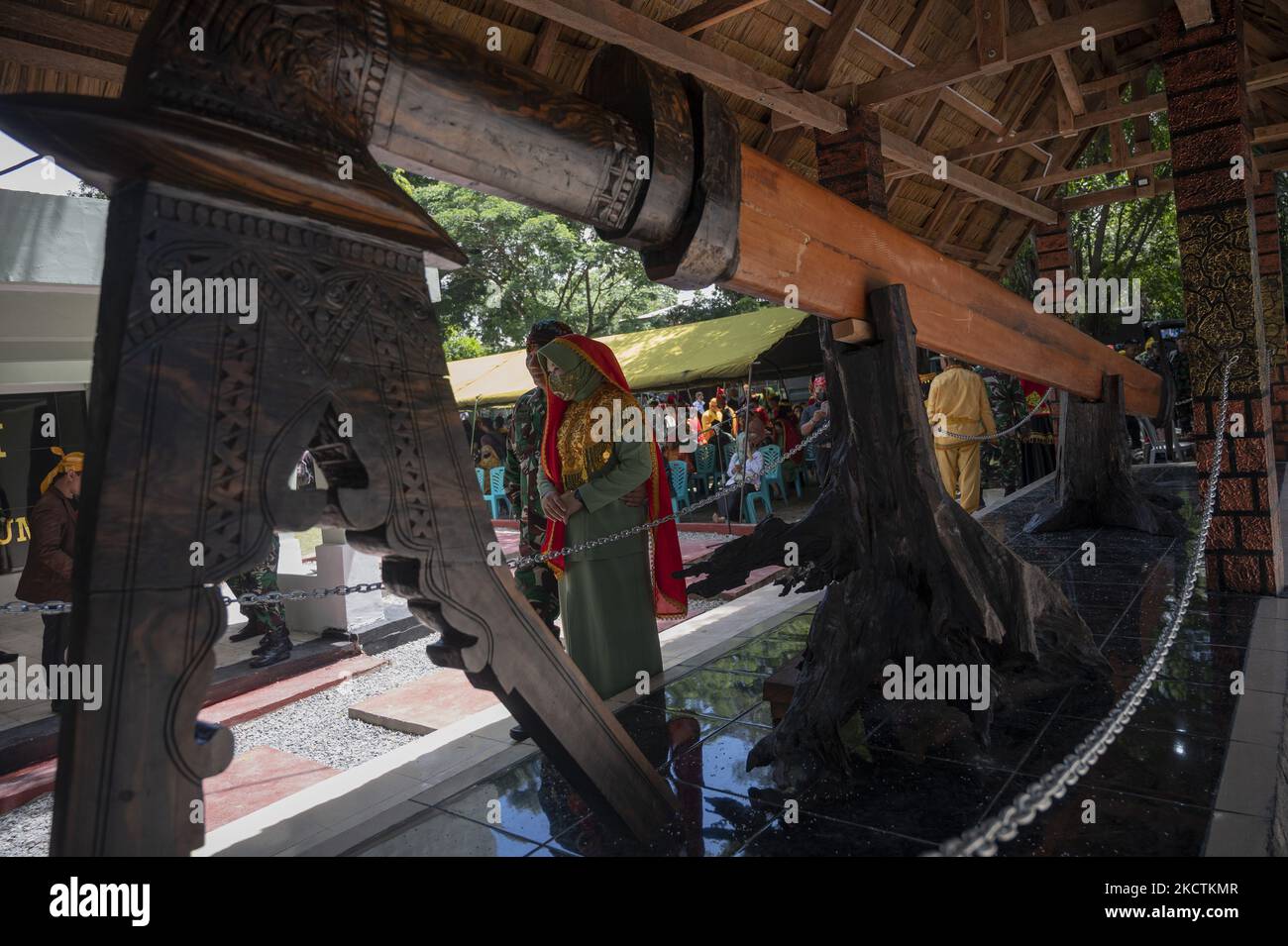 Residents walk near a giant 7.7 meter and 1.2 ton Guma traditional ...