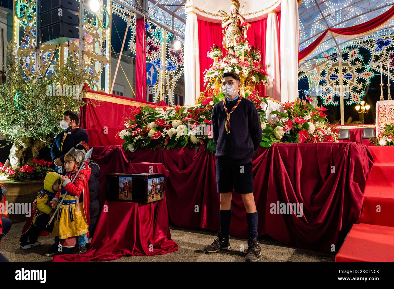 Children dressed as San Trifone in front of the exposed statue of the ...