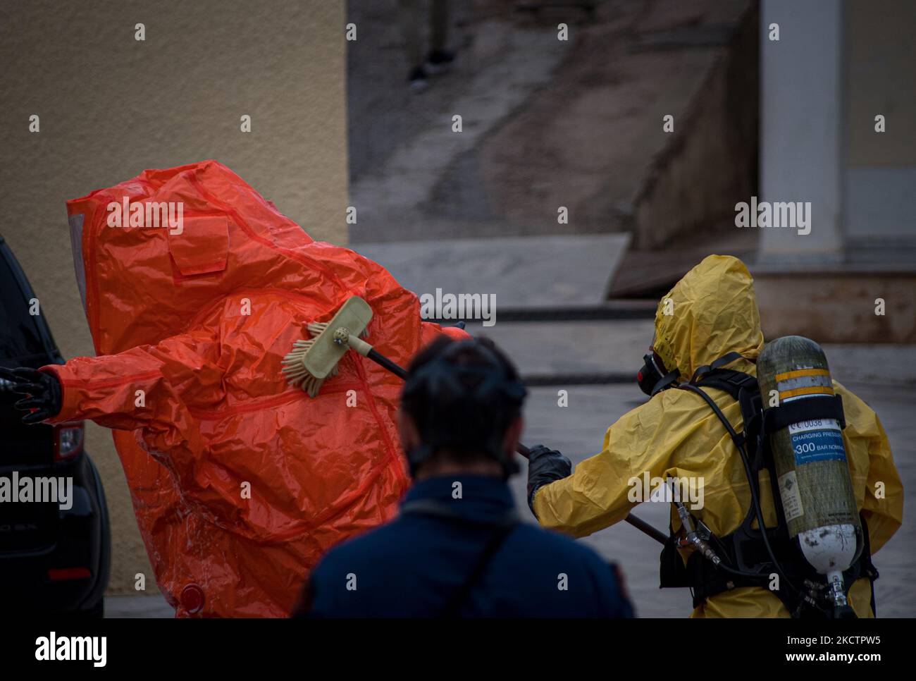 Pyrotechnicians of the Hellenic Fire Service getting checked for ...