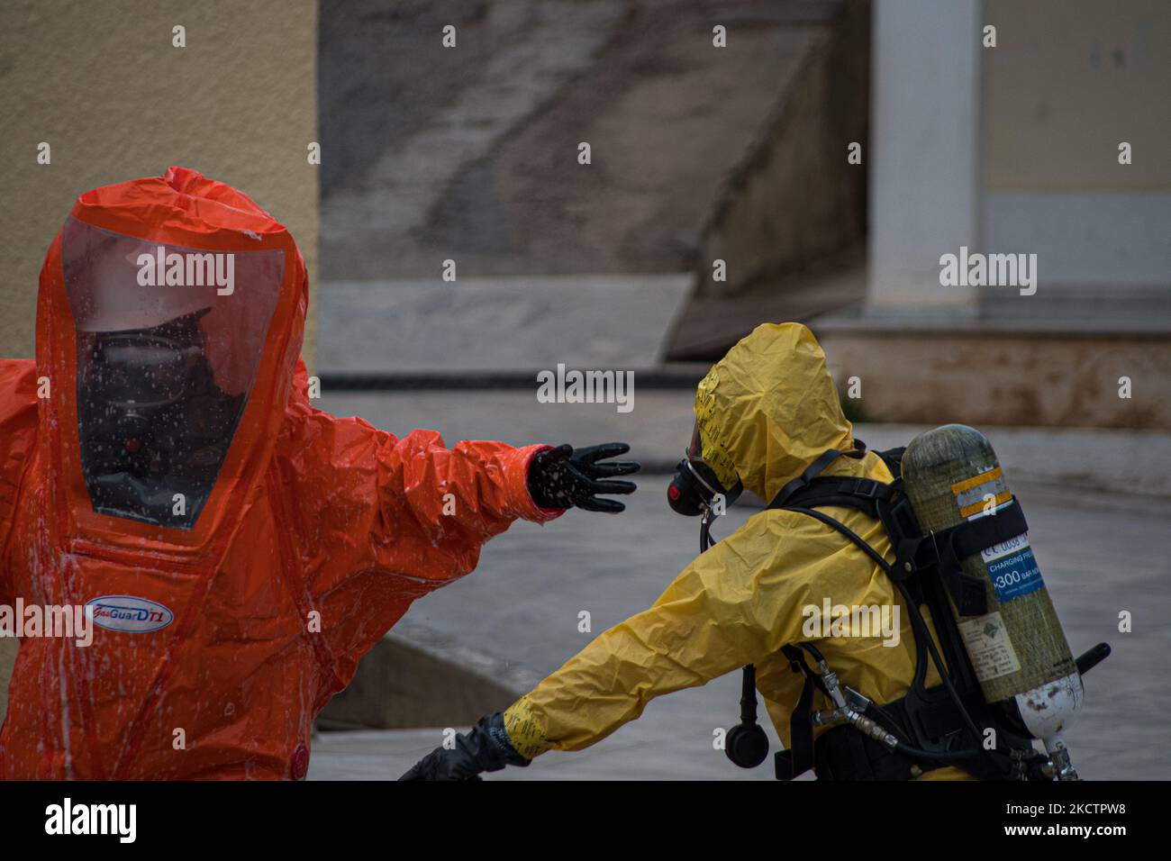 Pyrotechnicians of the Hellenic Fire Service getting checked for ...