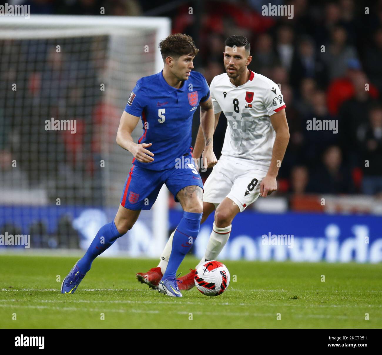 L-R John Stones (Man City) of England and Klaus Gjasula of Albania ...