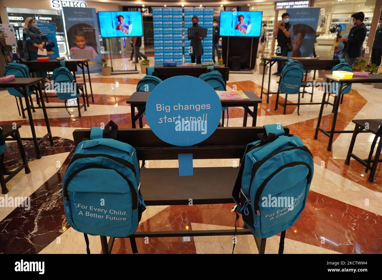 A speaker addresses after unveiling symbolic pandemic classroom during ...