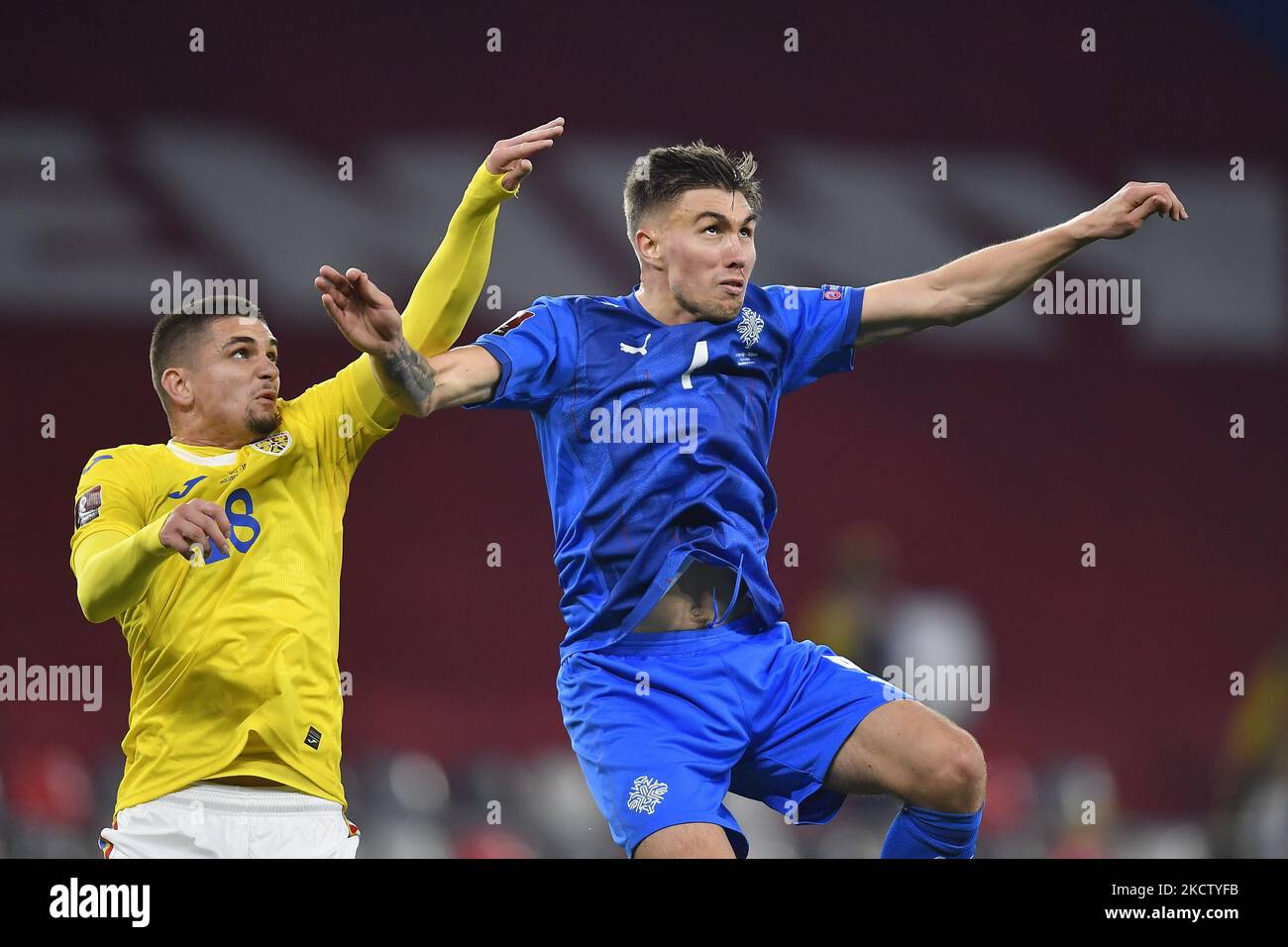 Daniel Leo Gretarsson and Razvan Marin in action during the FIFA World Cup Qatar 2022 ...